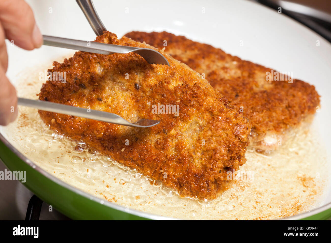 Cordon bleu preparation : Frying a cordon bleu Stock Photo - Alamy