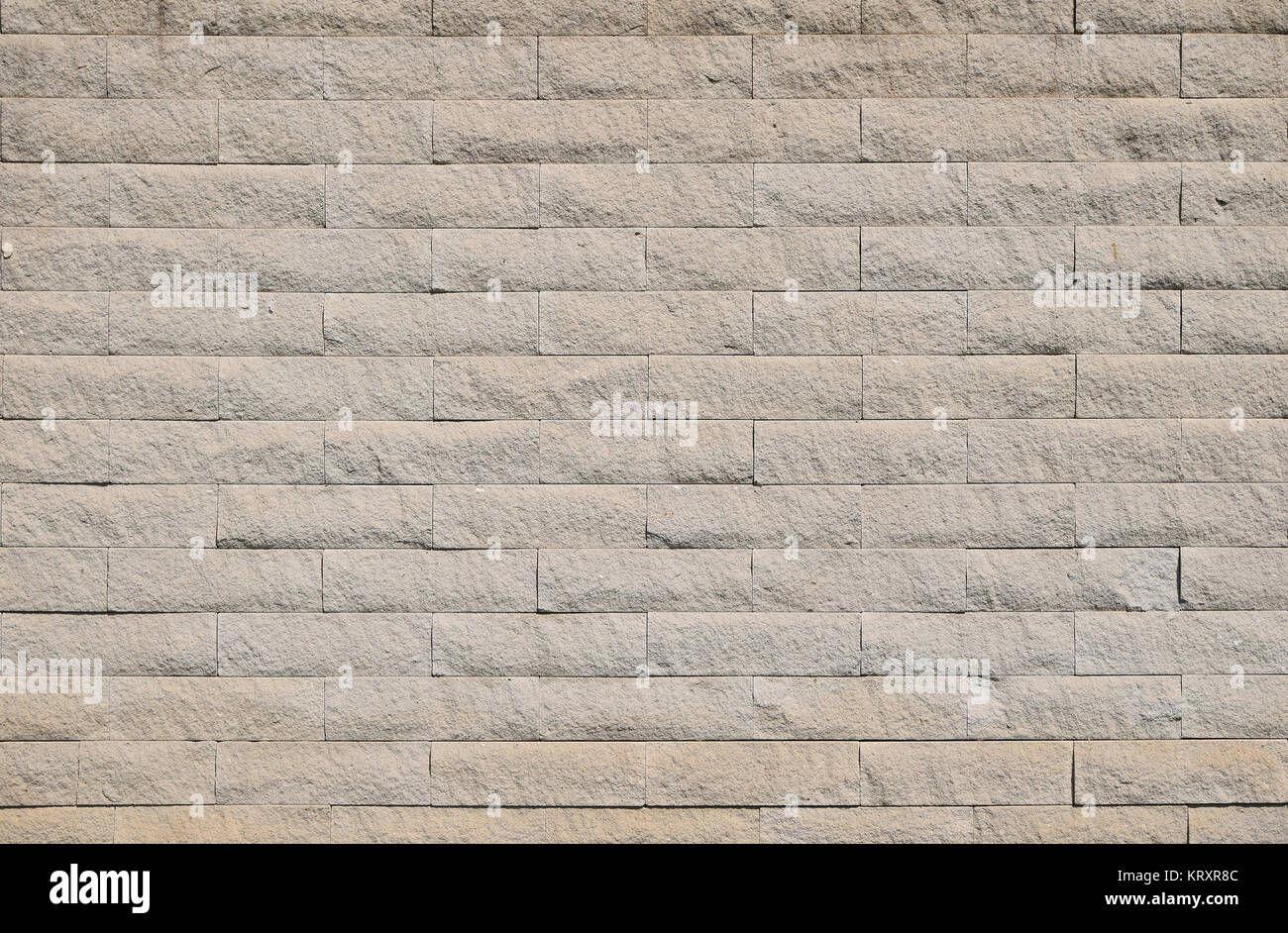 Beige brick stone tiles wall background texture Stock Photo - Alamy