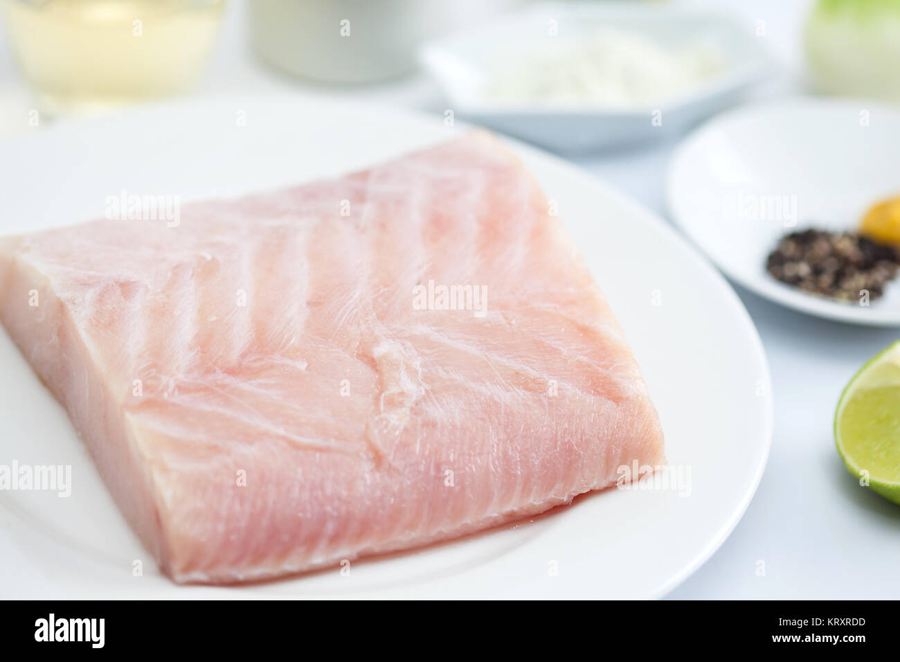 Fish fillet preparation : Raw sea bass fillet Stock Photo - Alamy