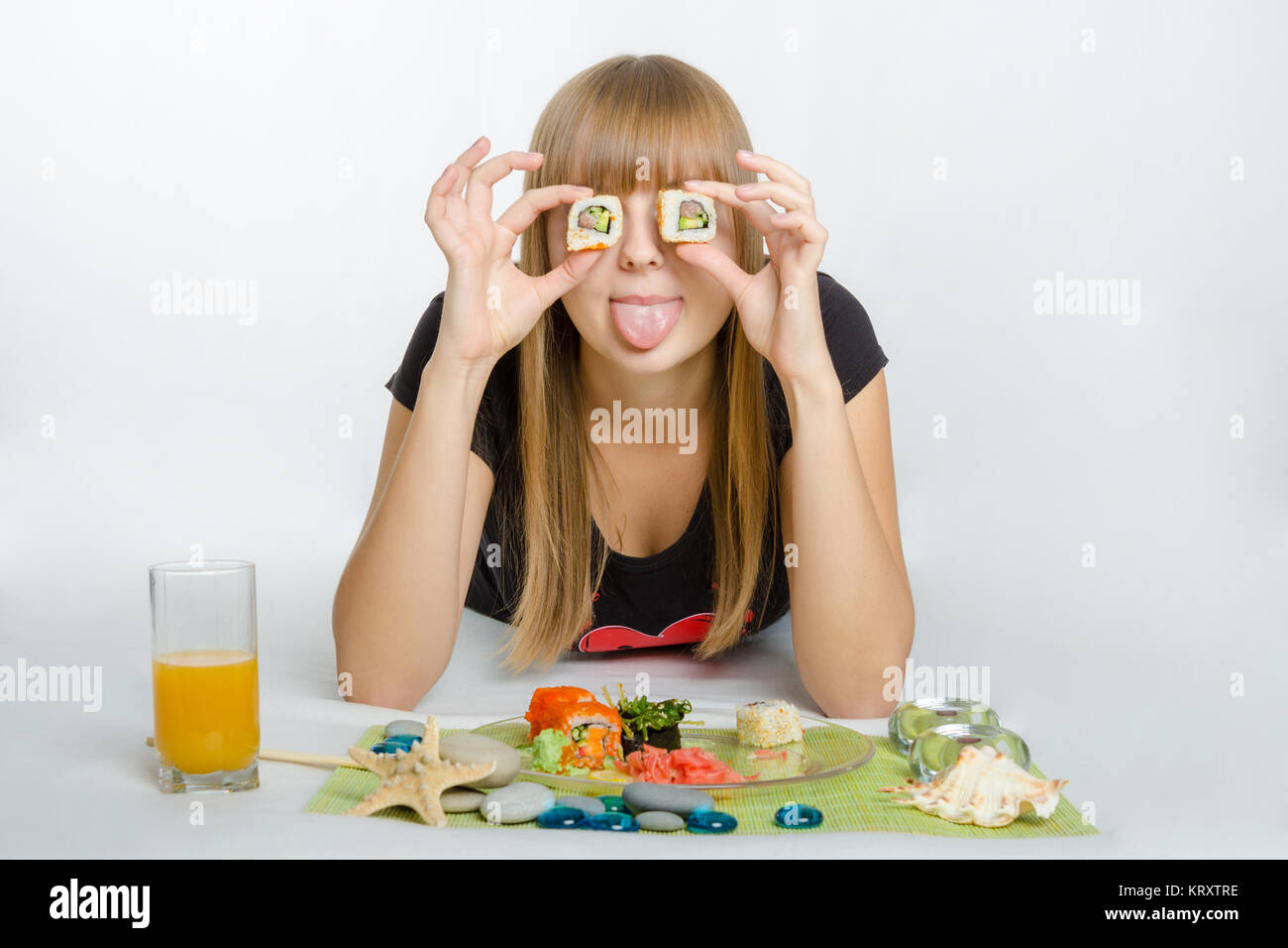 Young girl put roll your eyes and stuck out her tongue Stock Photo - Alamy