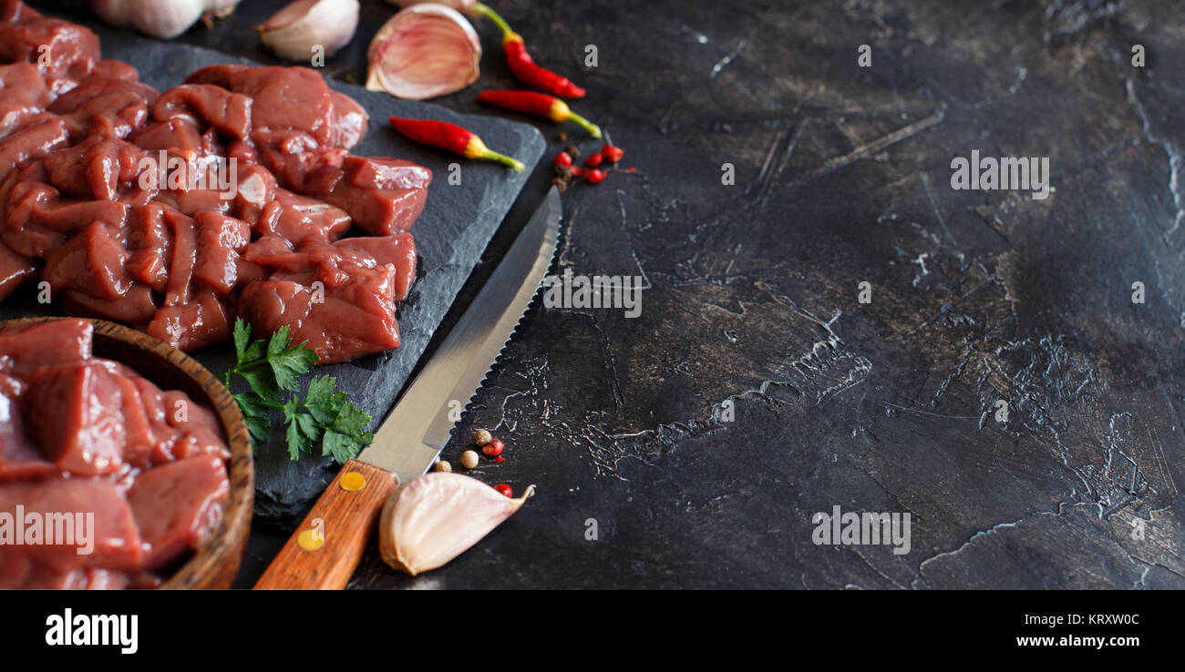 Raw beef liver with spices, herbs and vegetables Stock Photo - Alamy