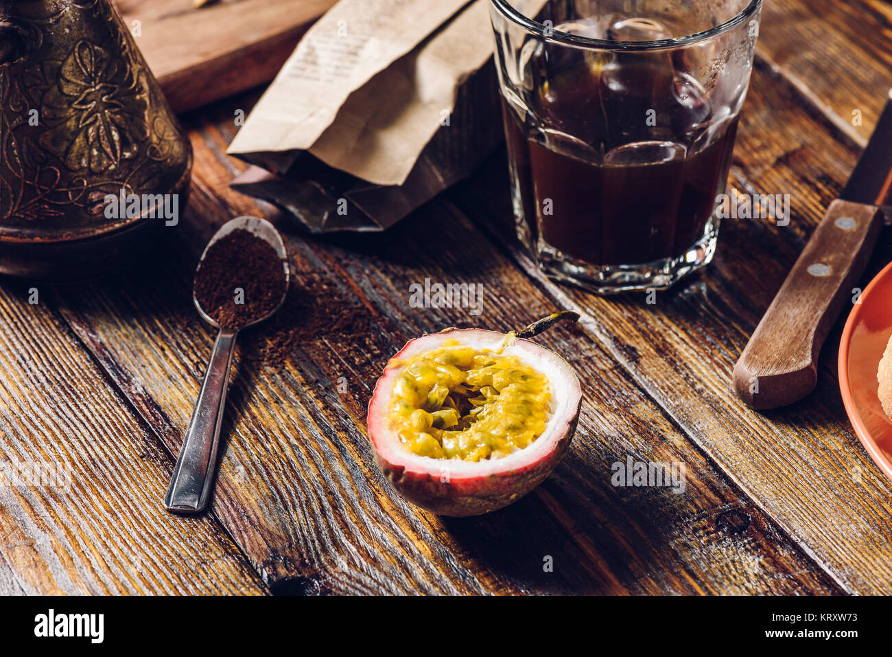 Glass of Coffee with Passion Fruit Half Stock Photo - Alamy