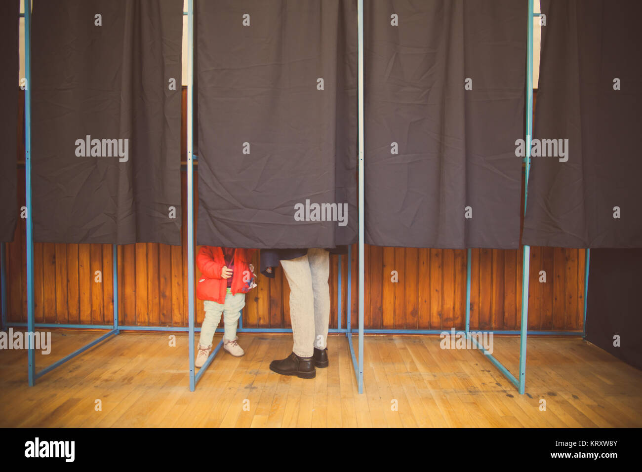 People vote in voting booth Stock Photo - Alamy