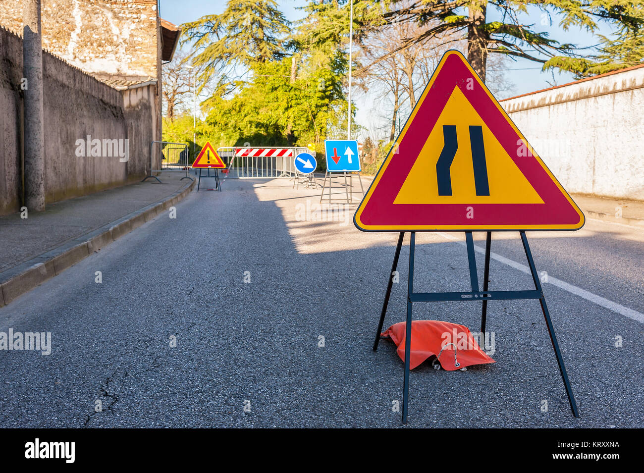 Road sign lane narrowing Stock Photo - Alamy