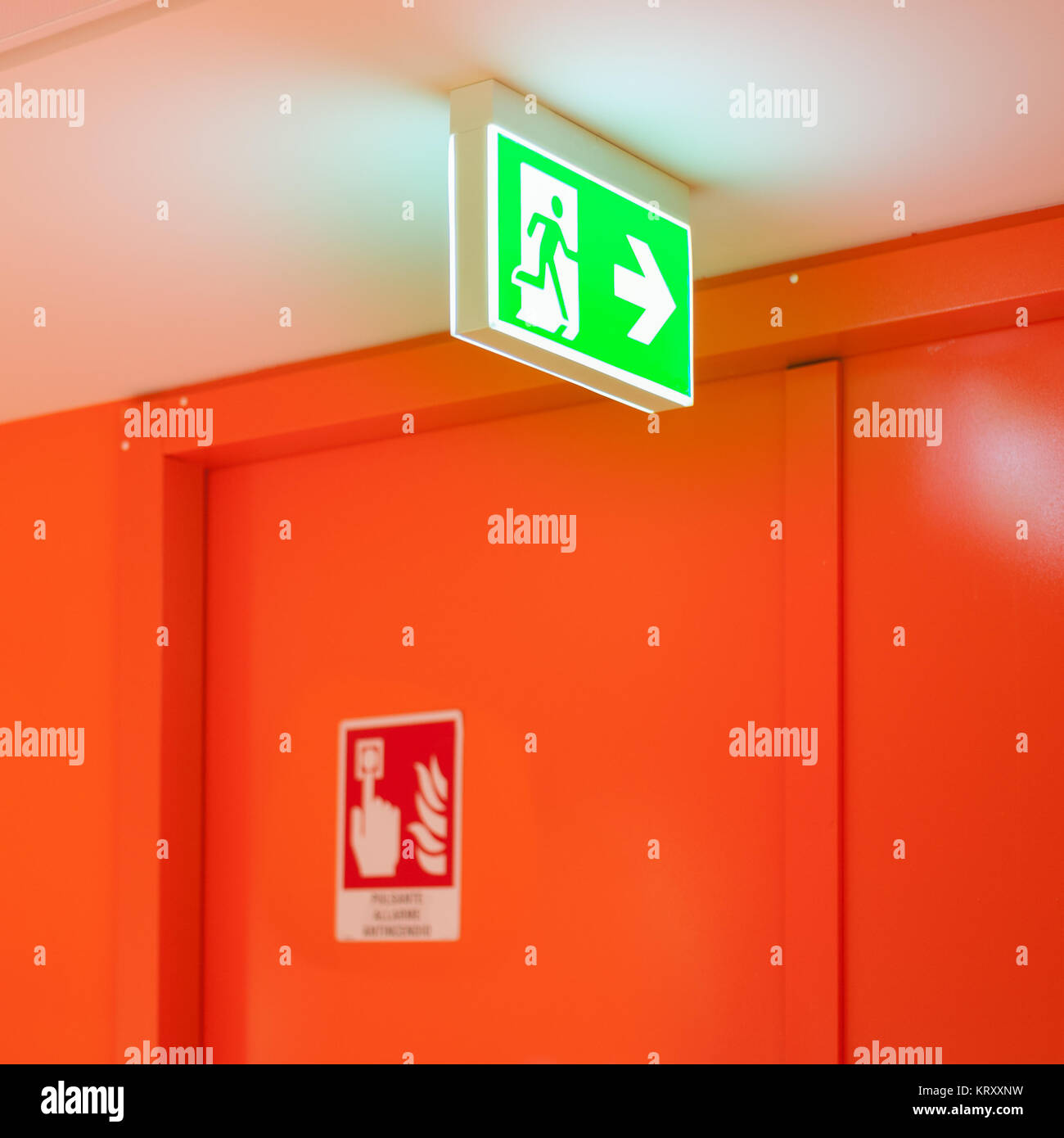 Bright green safety exit signal Stock Photo - Alamy