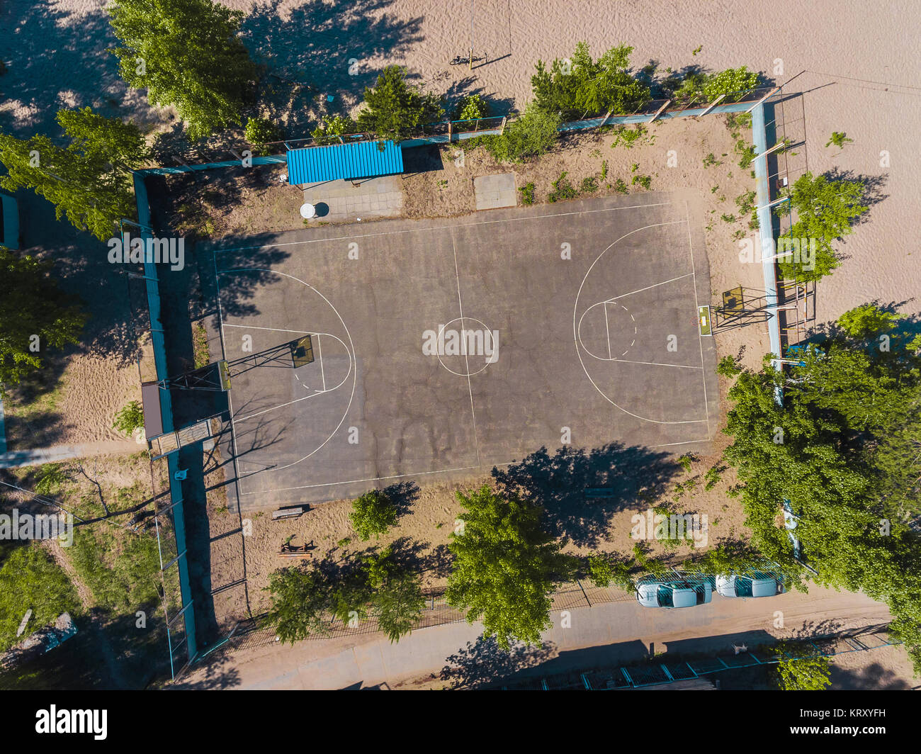Aerial view basketball field on day time on the beach. Above with drone ...