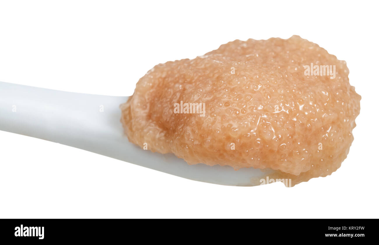 salty caviar of cod fish in ceramic spoon isolated Stock Photo - Alamy