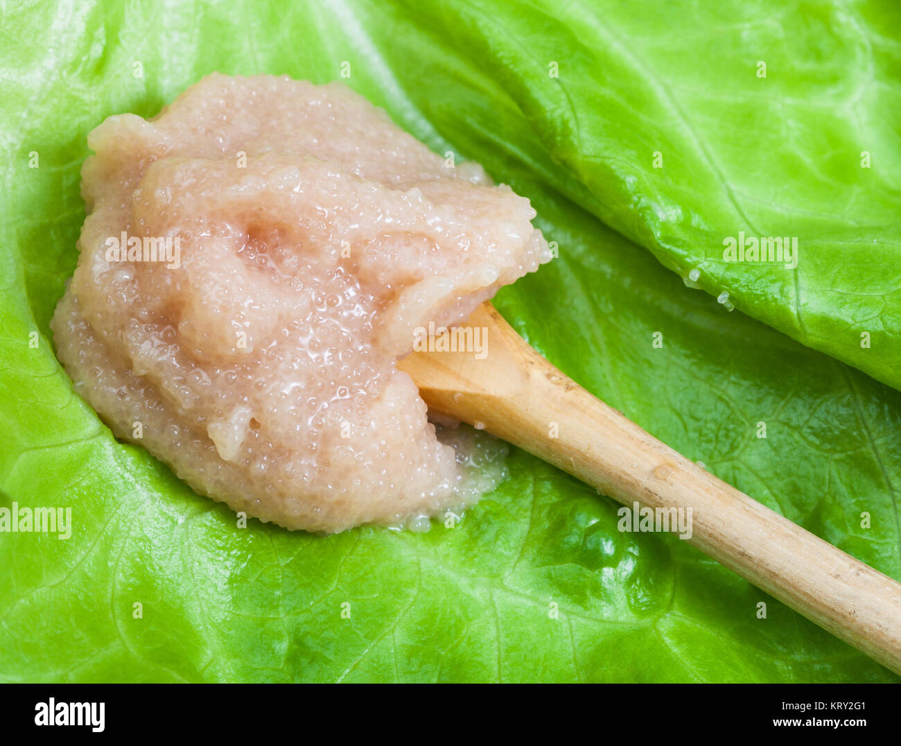 salty caviar of cod fish on spoon at green leaf Stock Photo - Alamy