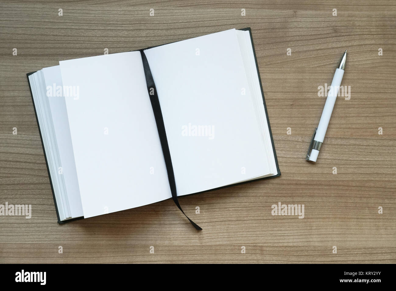 notebook and pen on desk Stock Photo - Alamy