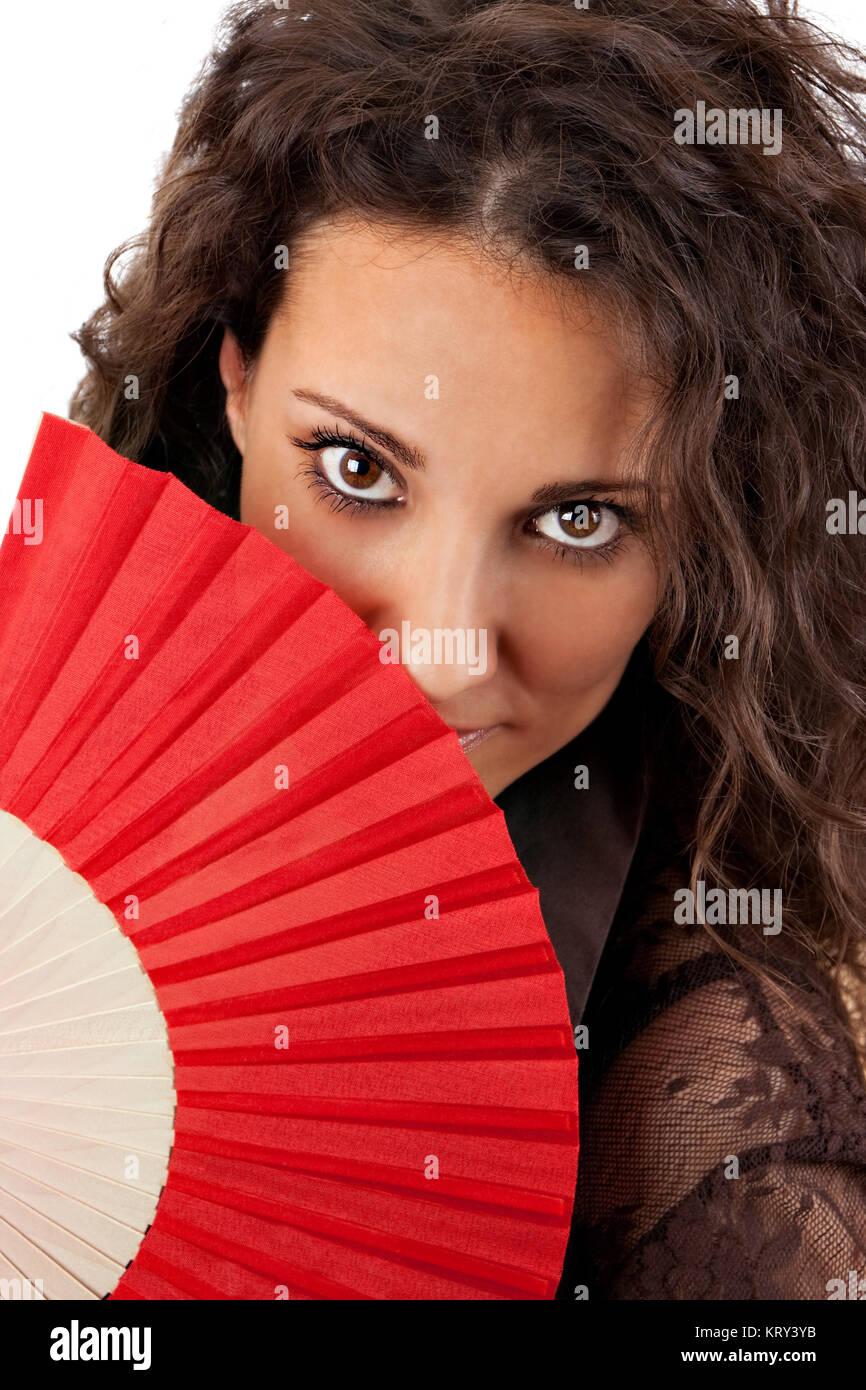 Beautiful woman with red fan Stock Photo - Alamy