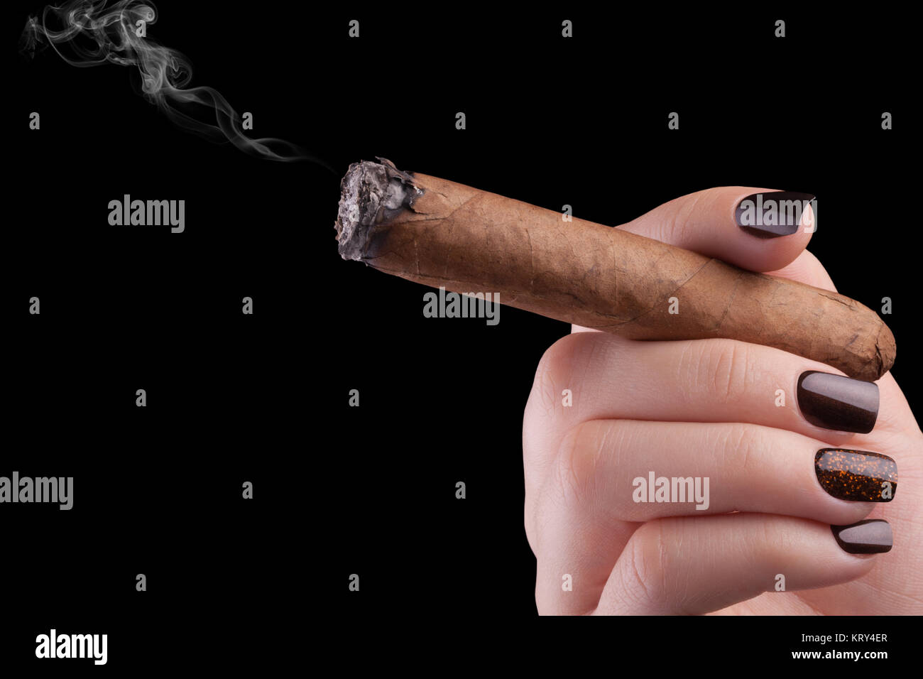 Very beautiful black nails close-up cigar Stock Photo - Alamy