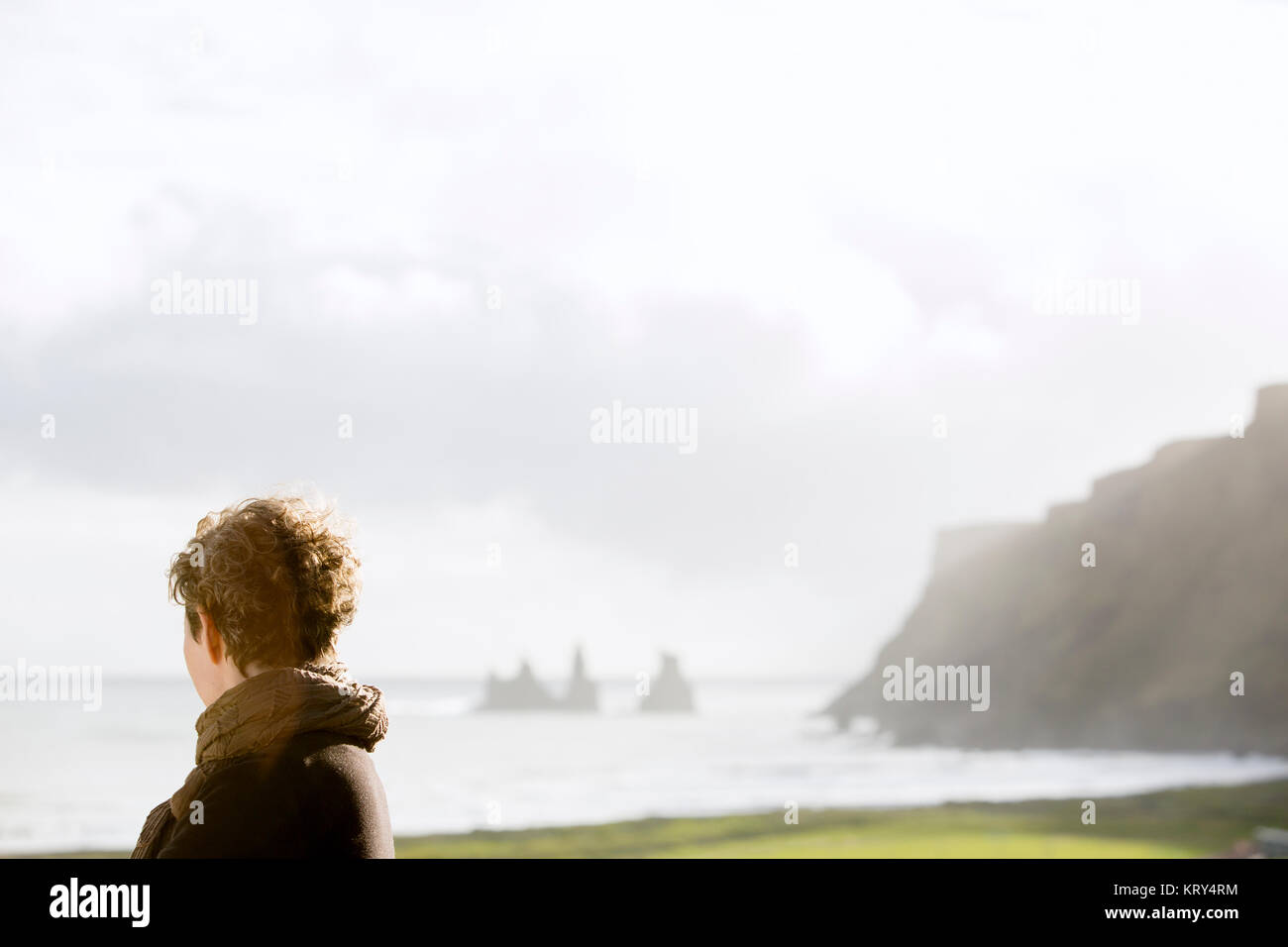 Woman looking out to sea hi-res stock photography and images - Alamy