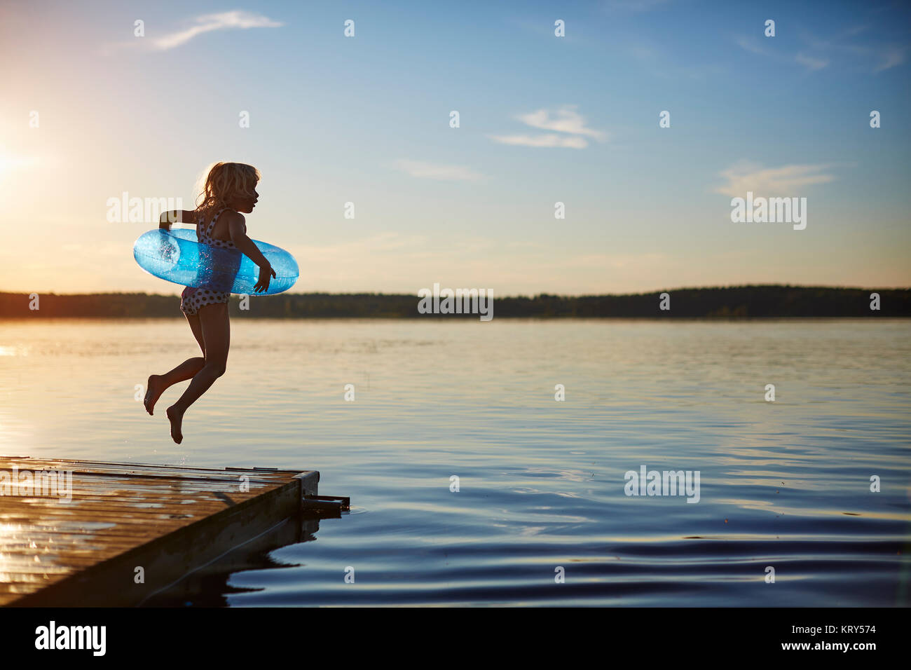 Child jumping off a pier hi-res stock photography and images - Alamy
