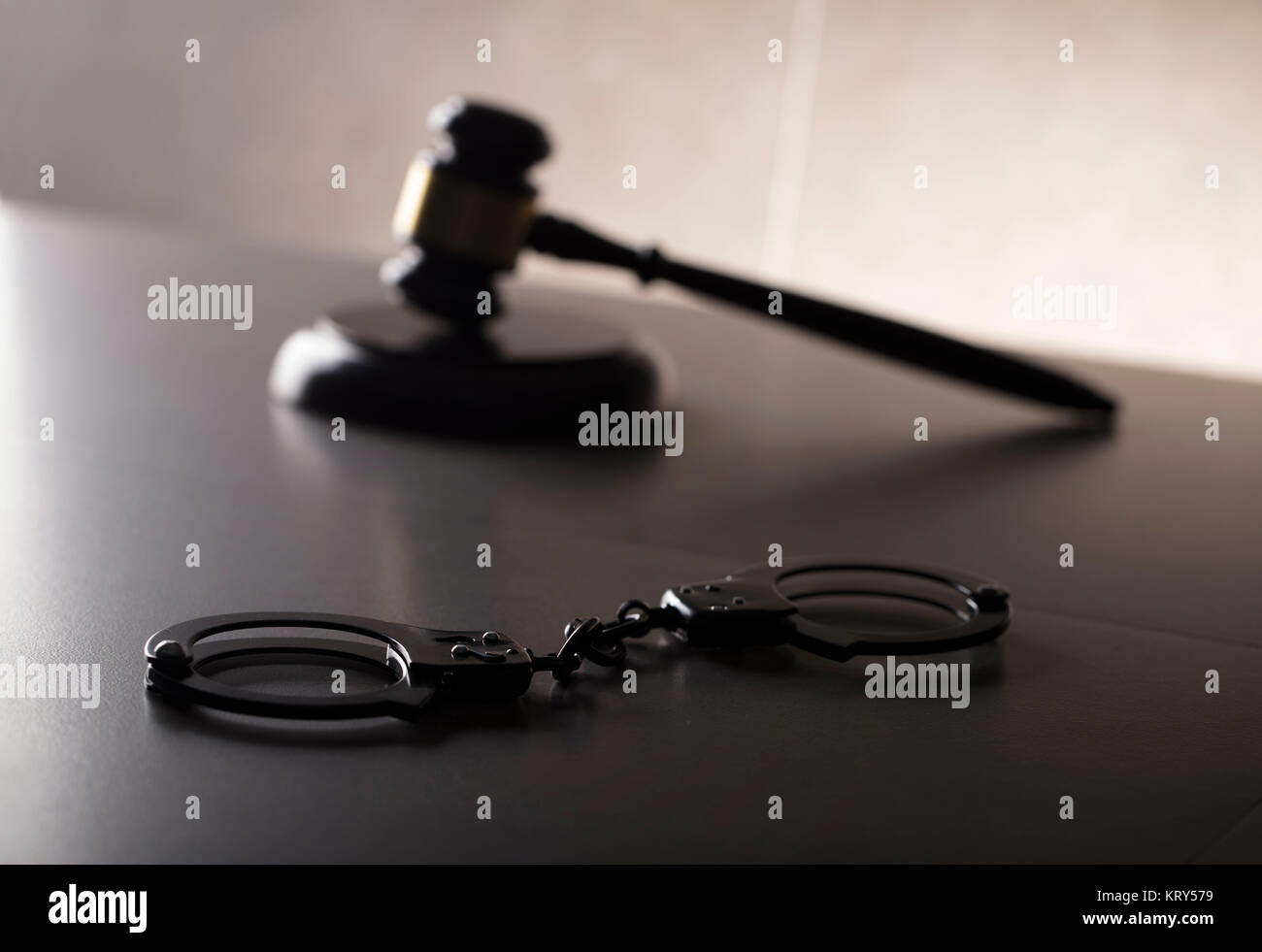 Criminal law concept. Cuffs and jugde gavel on stone background Stock ...