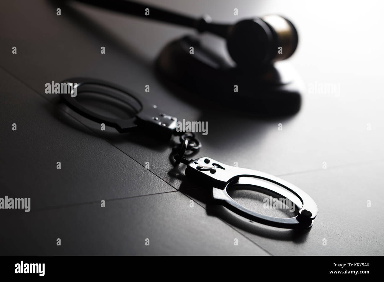 Criminal law concept. Cuffs and jugde gavel on stone background Stock ...