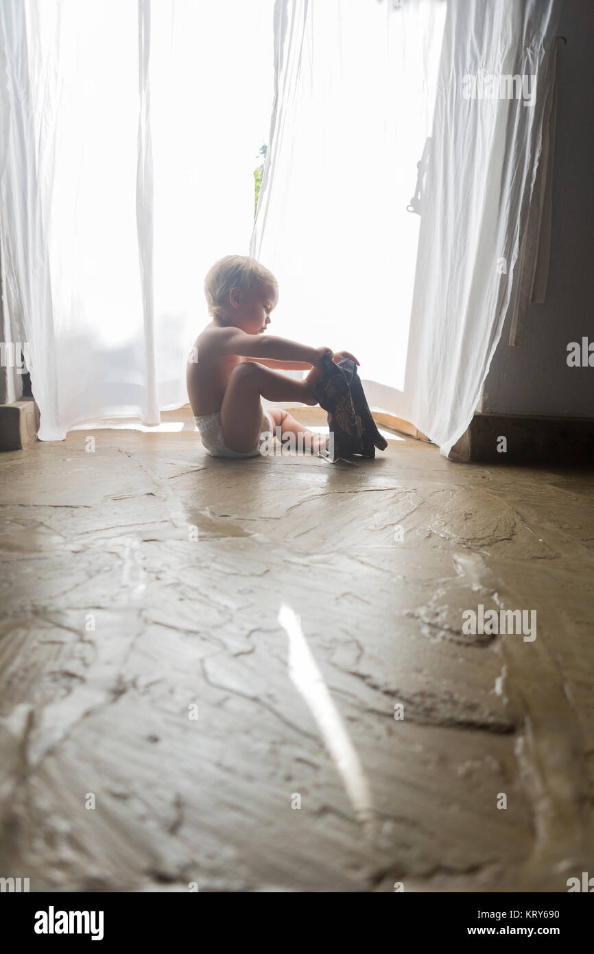 Child dressing himself hi-res stock photography and images - Alamy