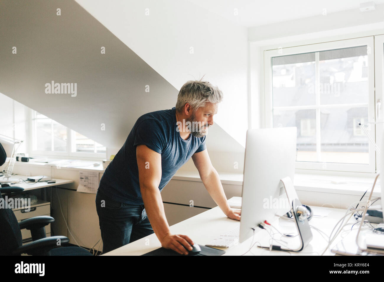 Man at an office desk Stock Photo - Alamy