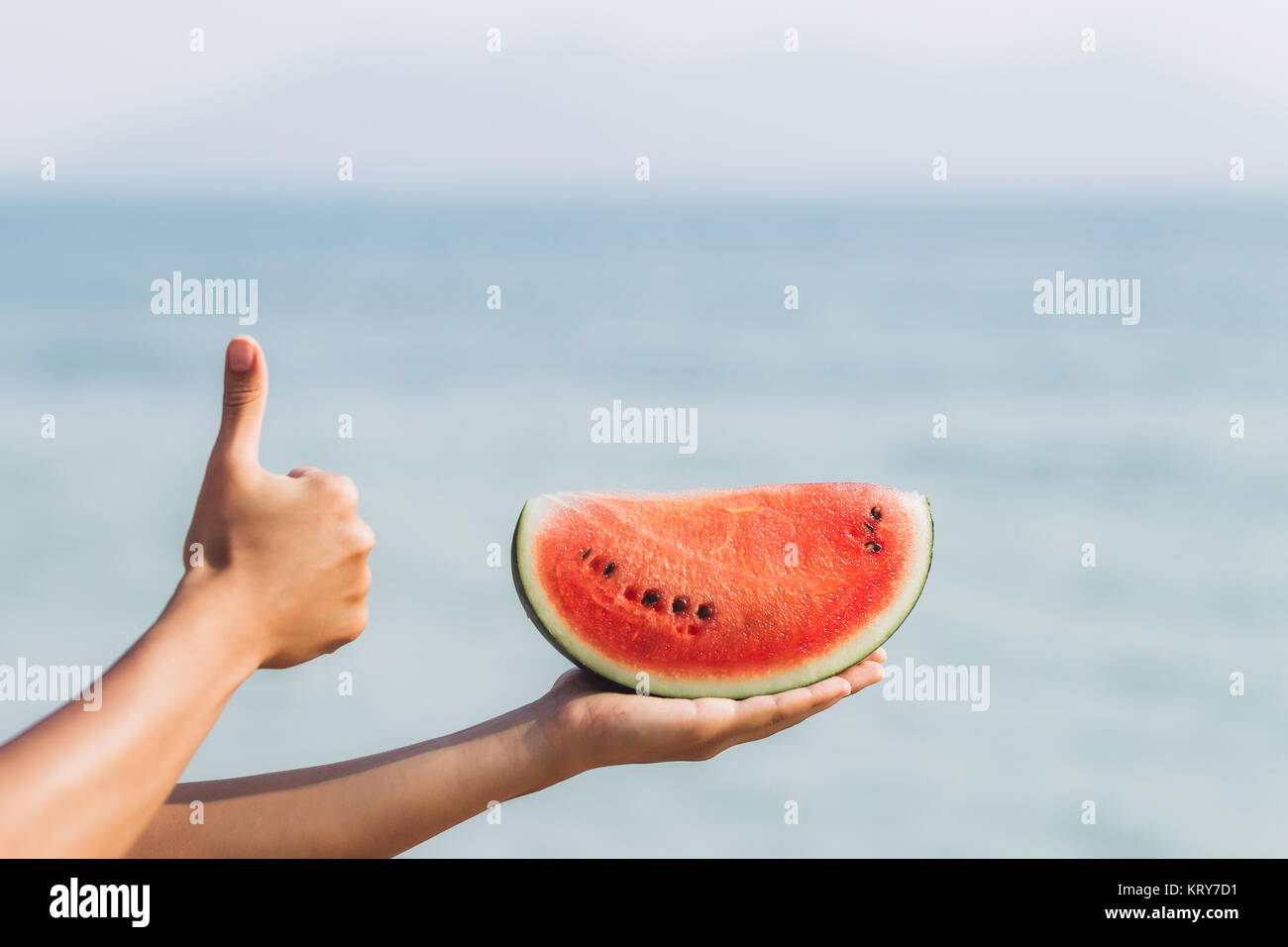 Watermelon in hand hi-res stock photography and images - Alamy