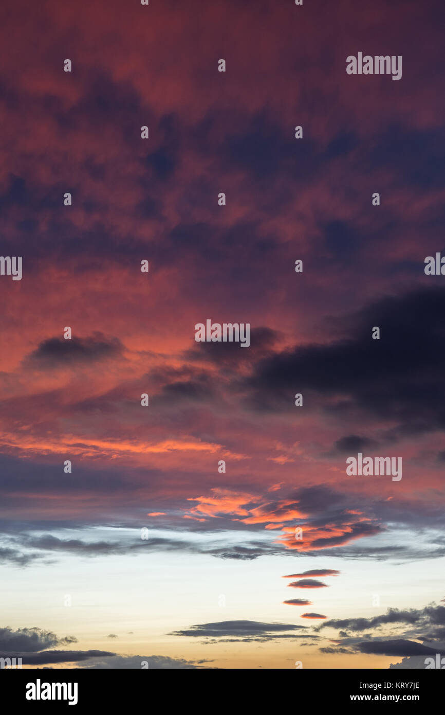 Beautiful red clouds at sunset, making abstract shapes Stock Photo - Alamy