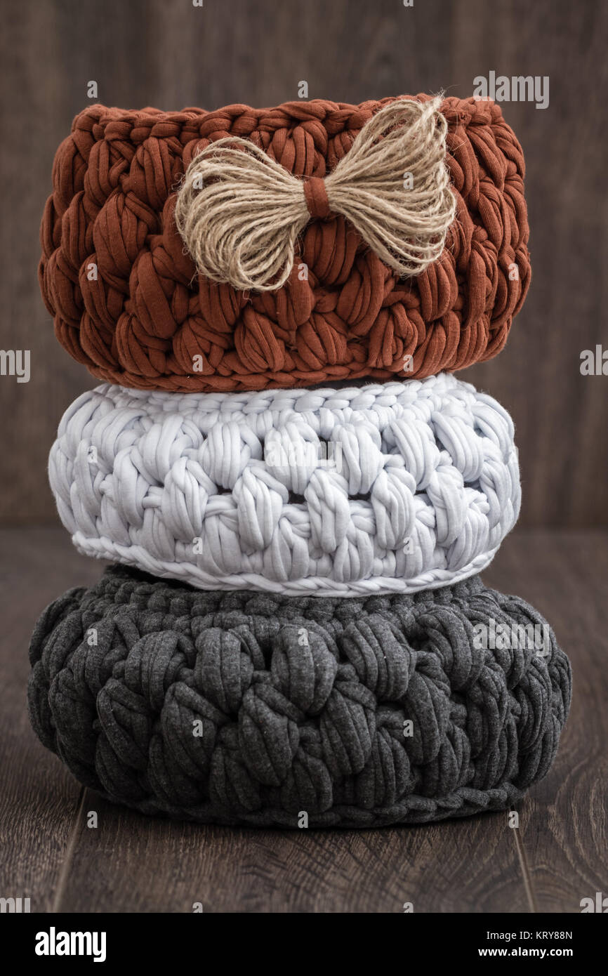 Decorative Knitted Baskets with Ribbons Stock Photo - Alamy