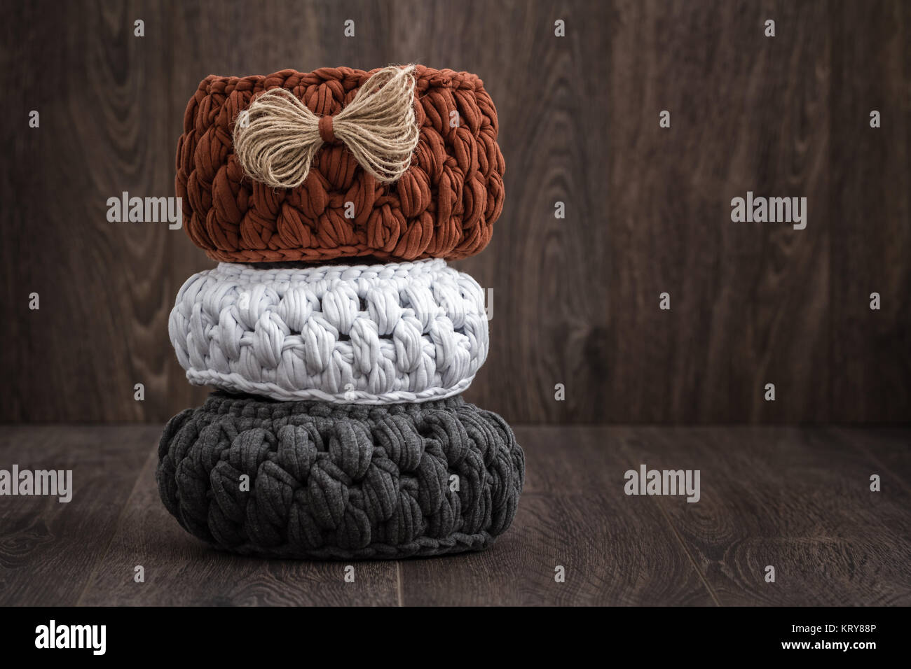 Decorative Knitted Baskets with Ribbons Stock Photo - Alamy