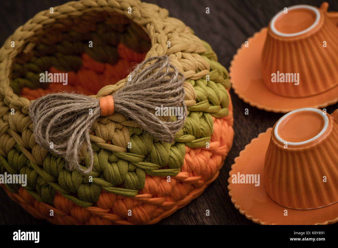 Decorative Knitted Basket with Ribbon Stock Photo - Alamy