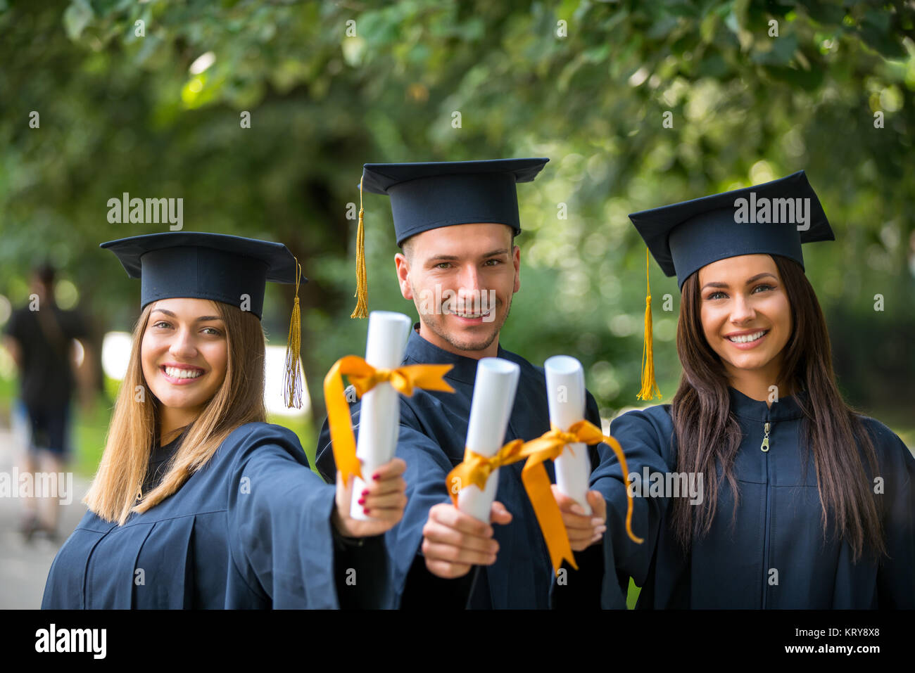 education, graduation, people concept - group of happy international ...