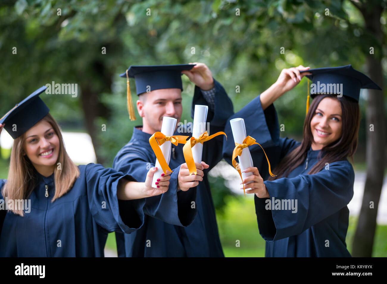 education, graduation, people concept - group of happy international ...