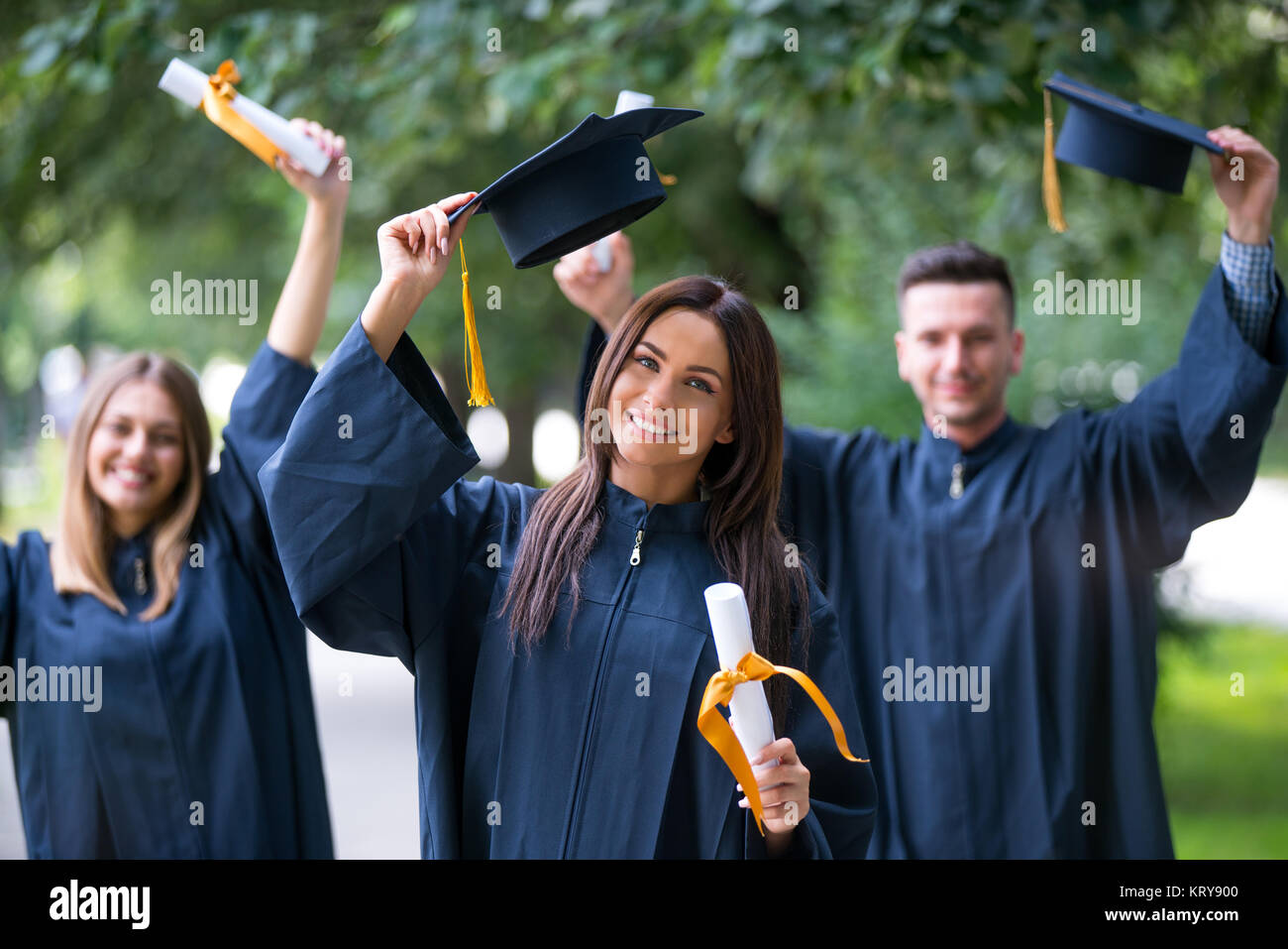 education, graduation, people concept - group of happy international ...