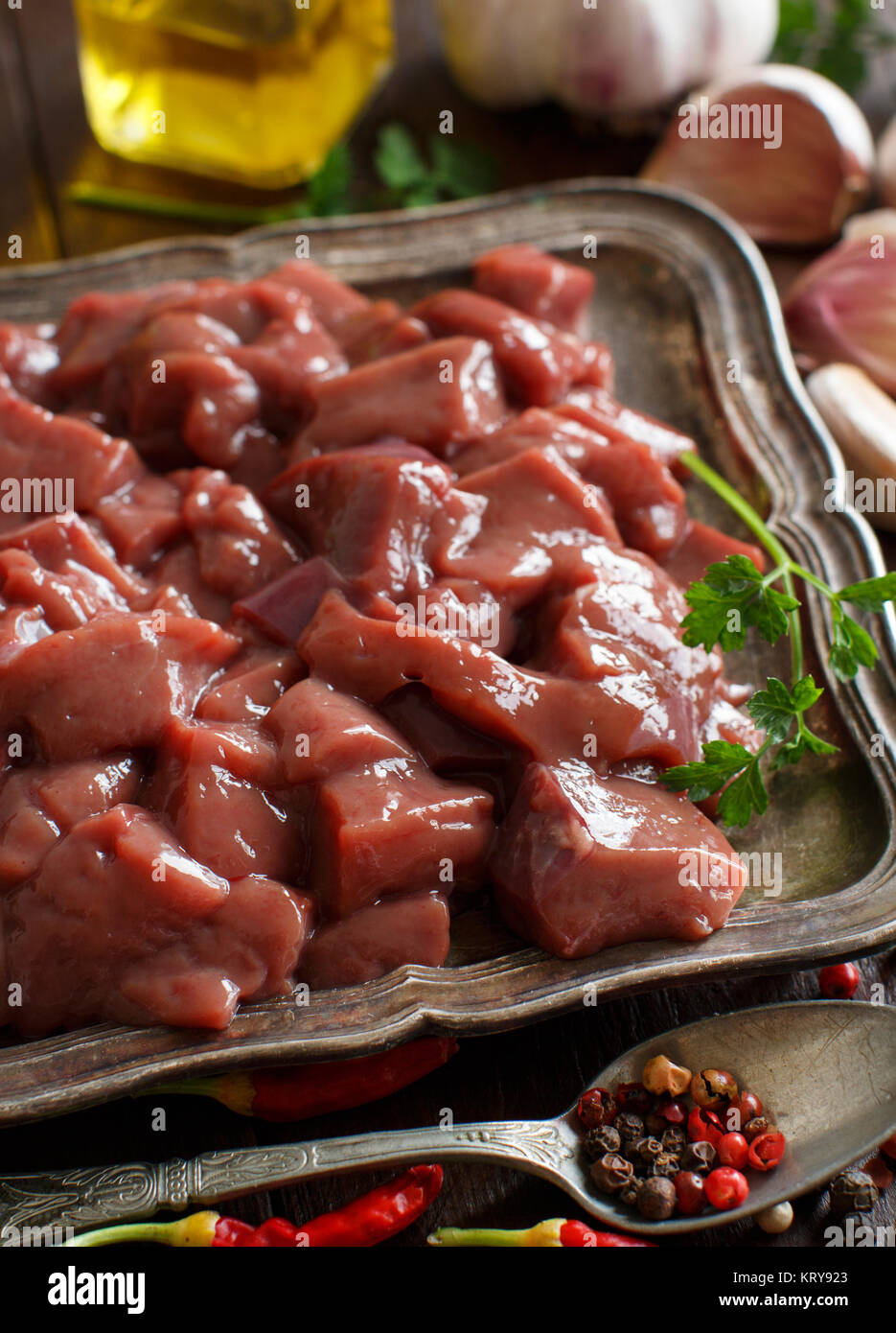 Raw beef liver with spices, herbs and vegetables Stock Photo - Alamy