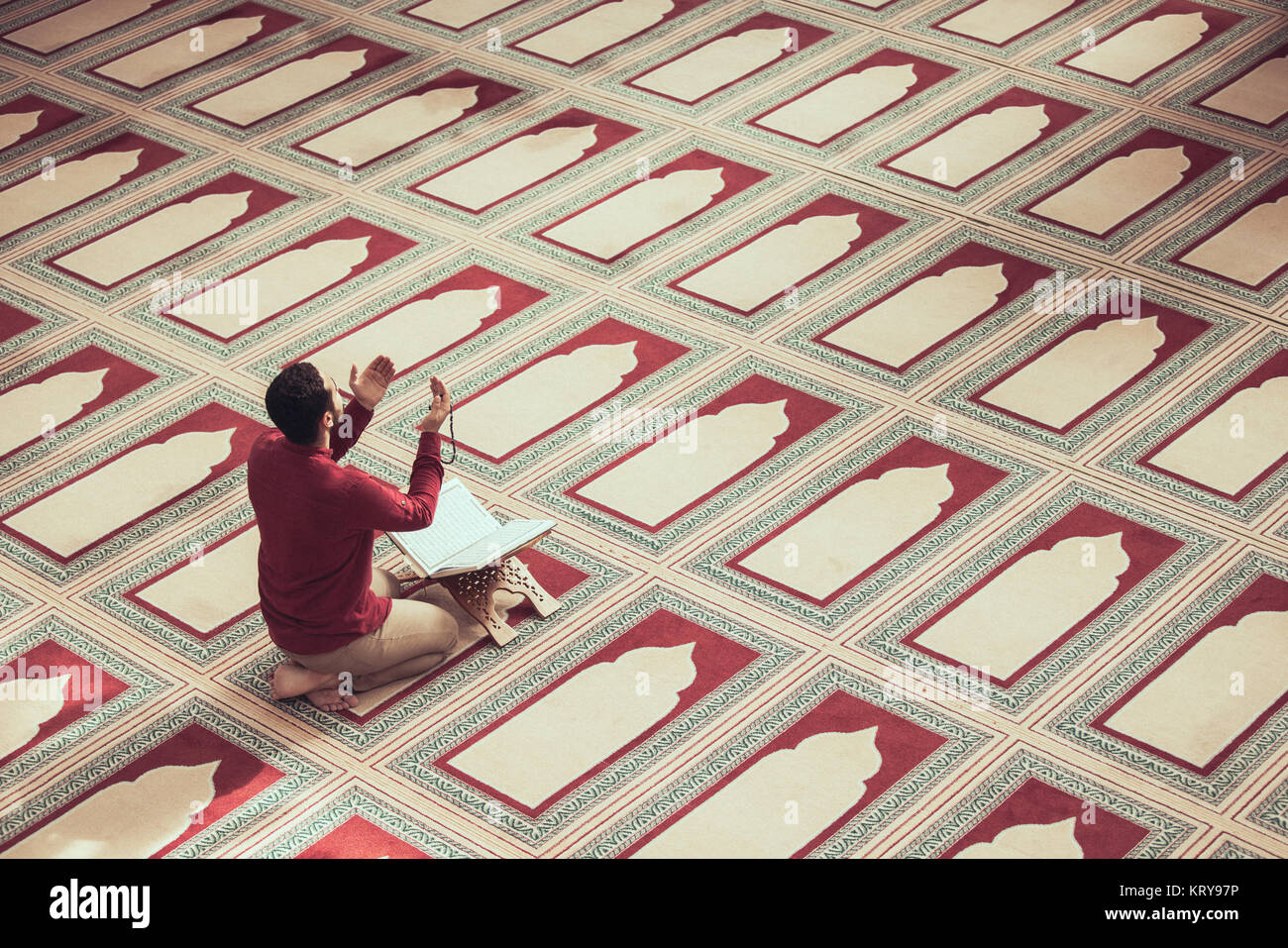 Religious muslim man praying inside the mosque Stock Photo - Alamy