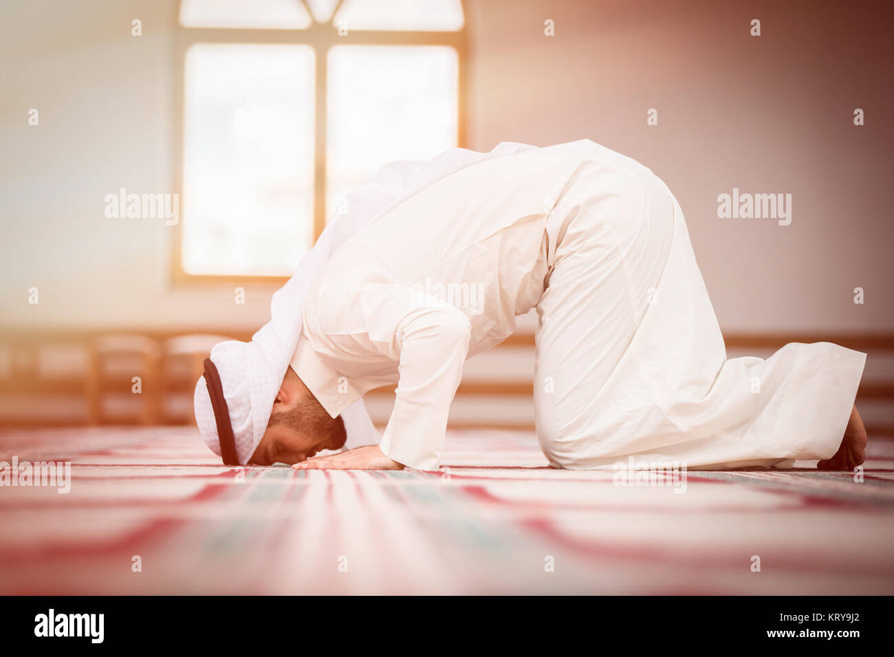 Religious muslim man praying inside the mosque Stock Photo - Alamy