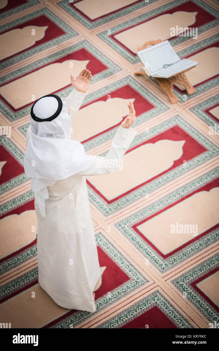 Religious muslim man praying inside the mosque Stock Photo - Alamy