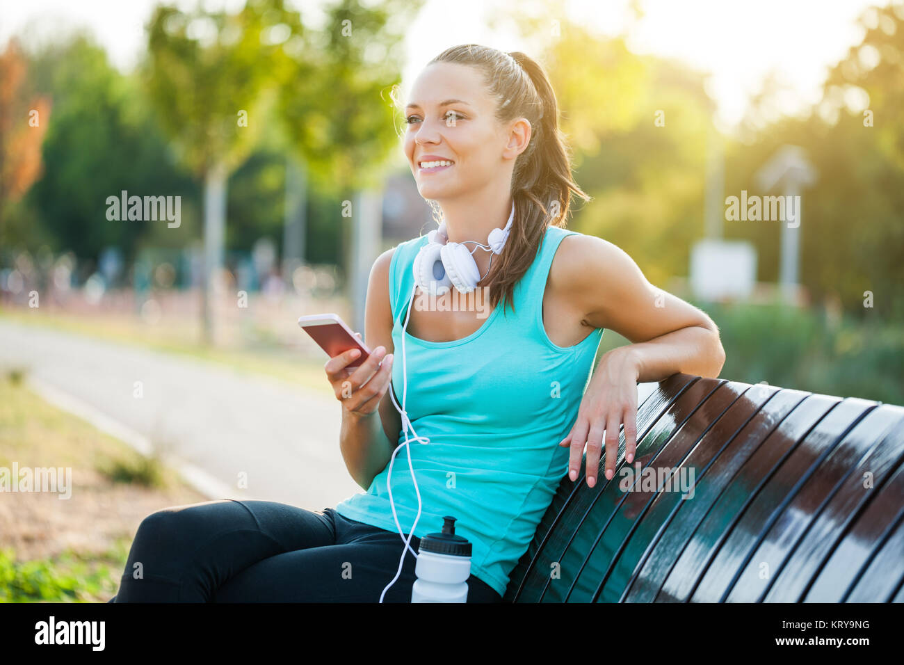 Young woman relaxing after jogging hi-res stock photography and images ...