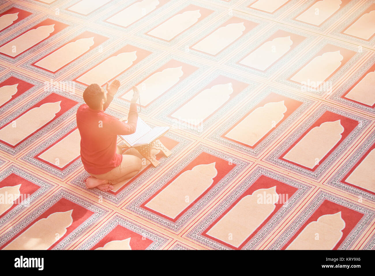 Religious muslim man praying inside the mosque Stock Photo - Alamy