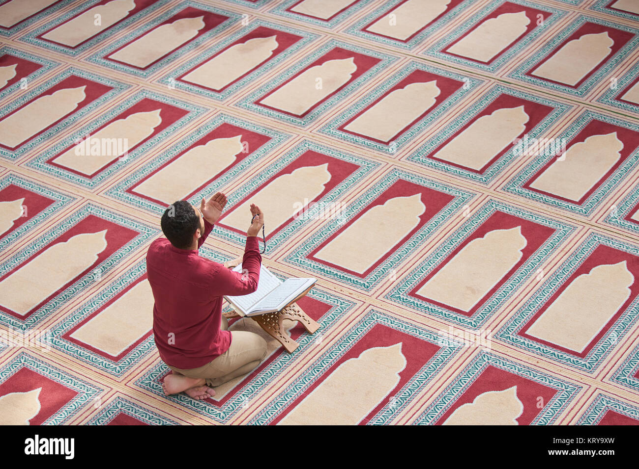 Religious muslim man praying inside the mosque Stock Photo - Alamy