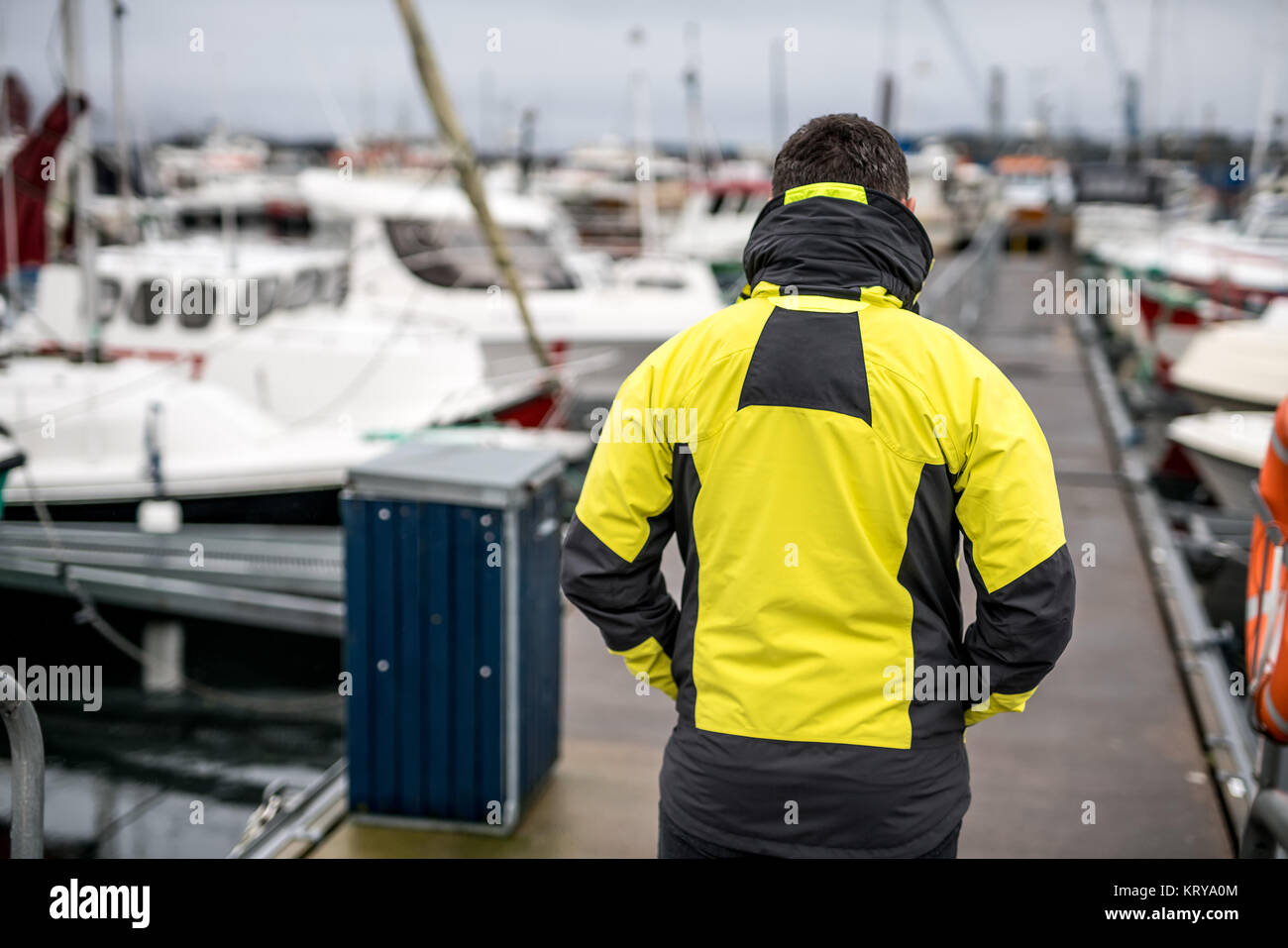 Man walking in dock Stock Photo - Alamy