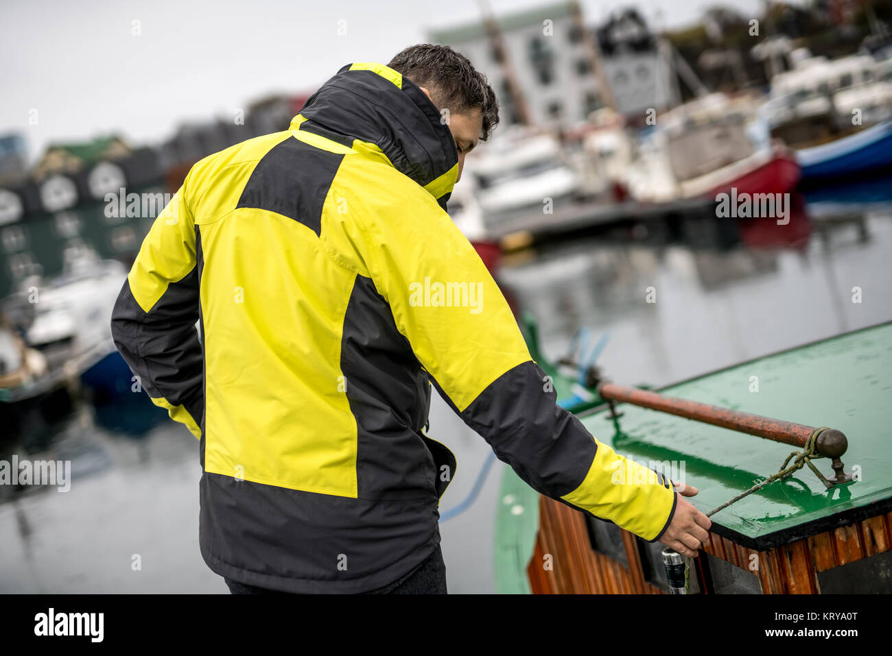 Man standing in dock Stock Photo - Alamy