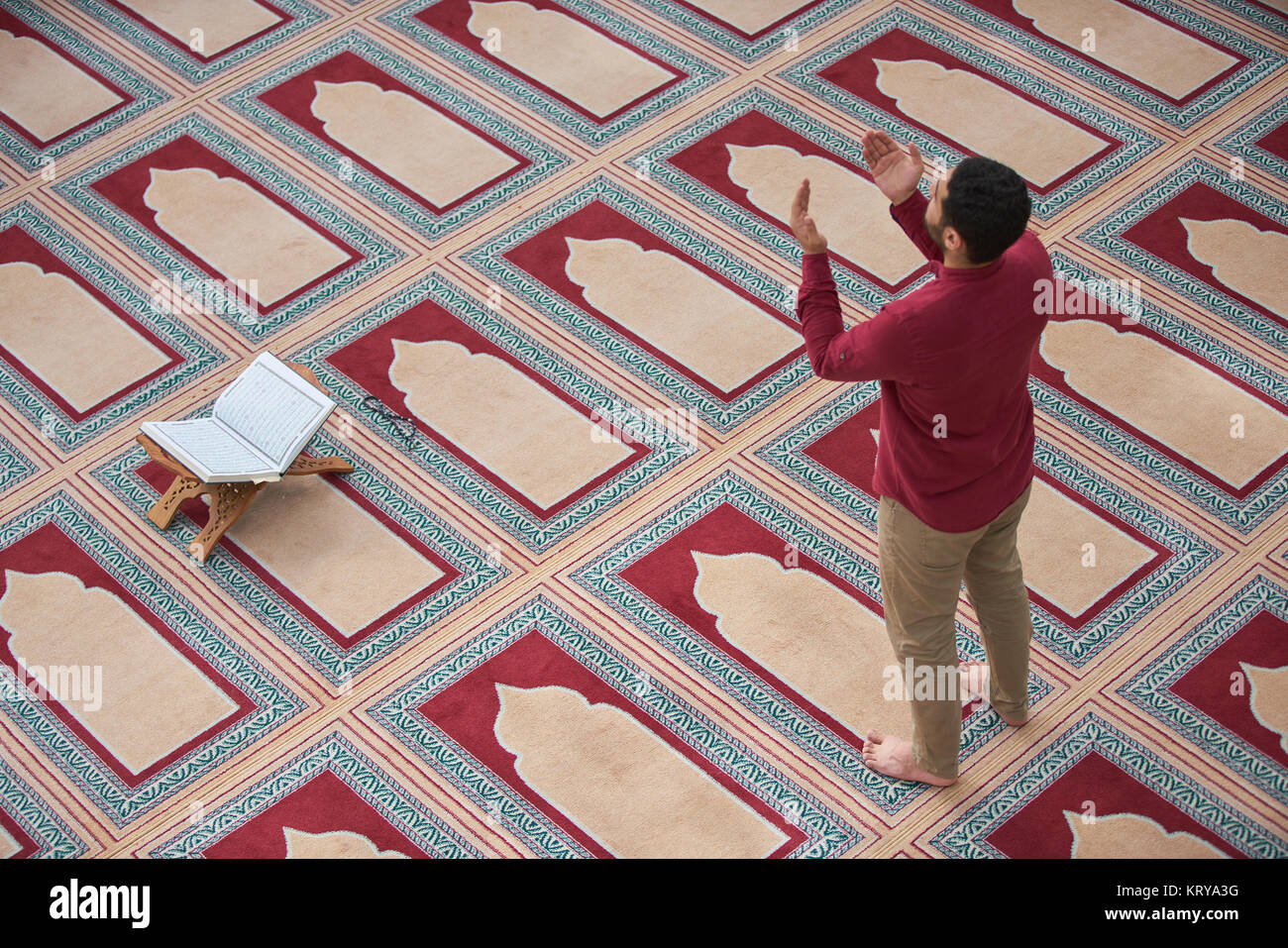 Religious muslim man praying inside the mosque Stock Photo - Alamy