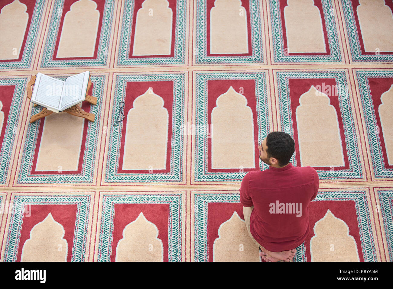 Religious muslim man praying inside the mosque Stock Photo - Alamy