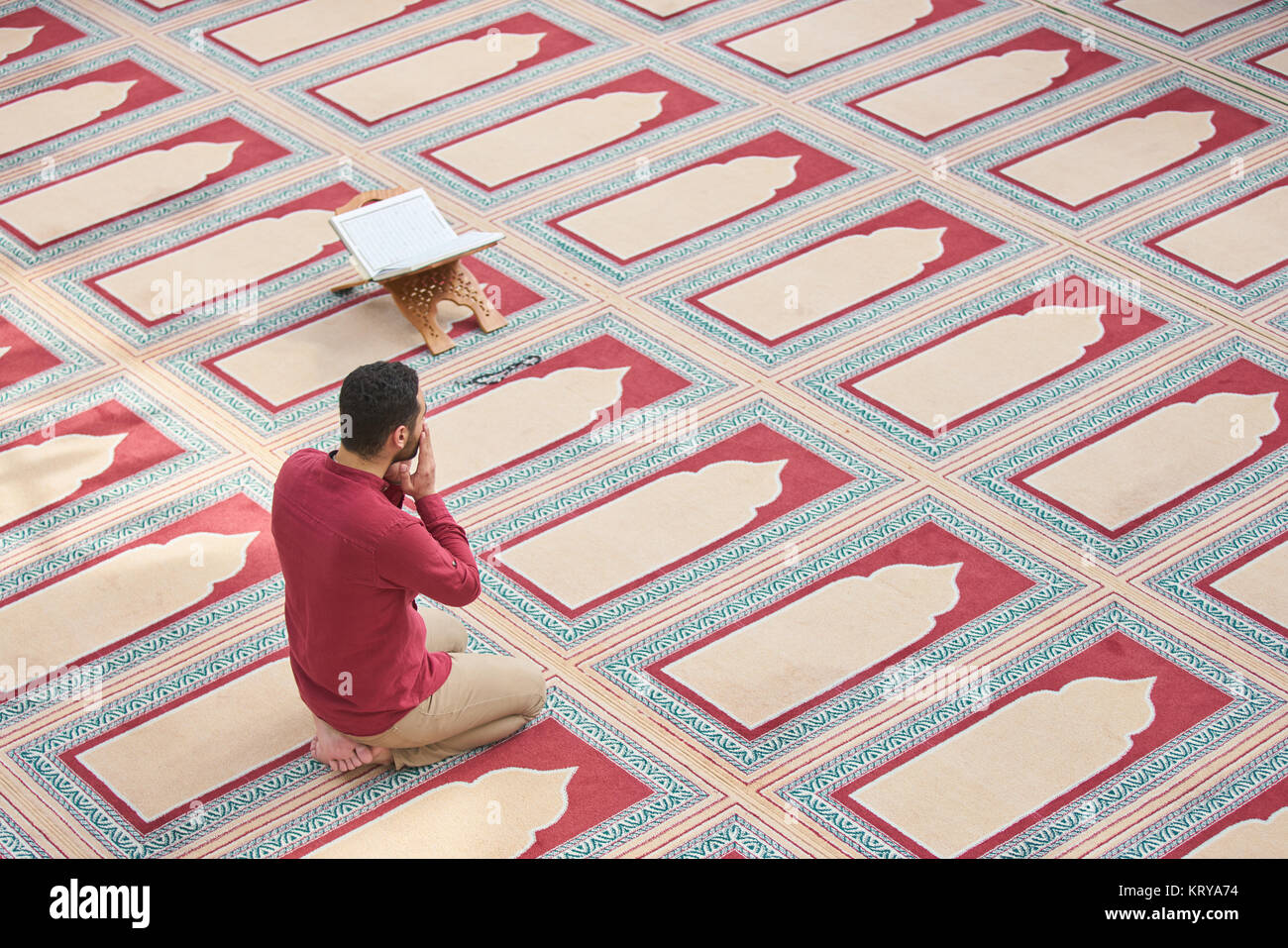 Religious muslim man praying inside the mosque Stock Photo - Alamy