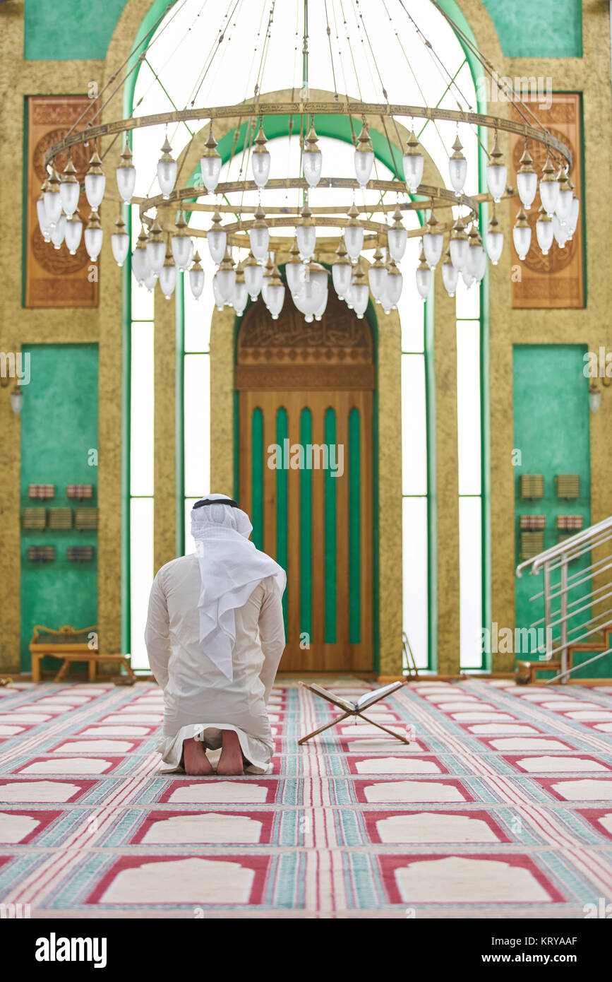 Religious muslim man praying inside the mosque Stock Photo - Alamy