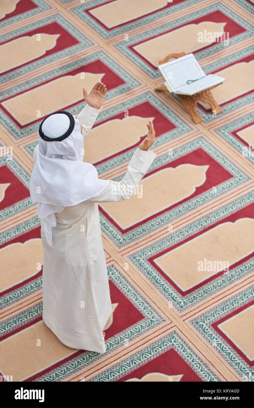 Religious muslim man praying inside the mosque Stock Photo - Alamy