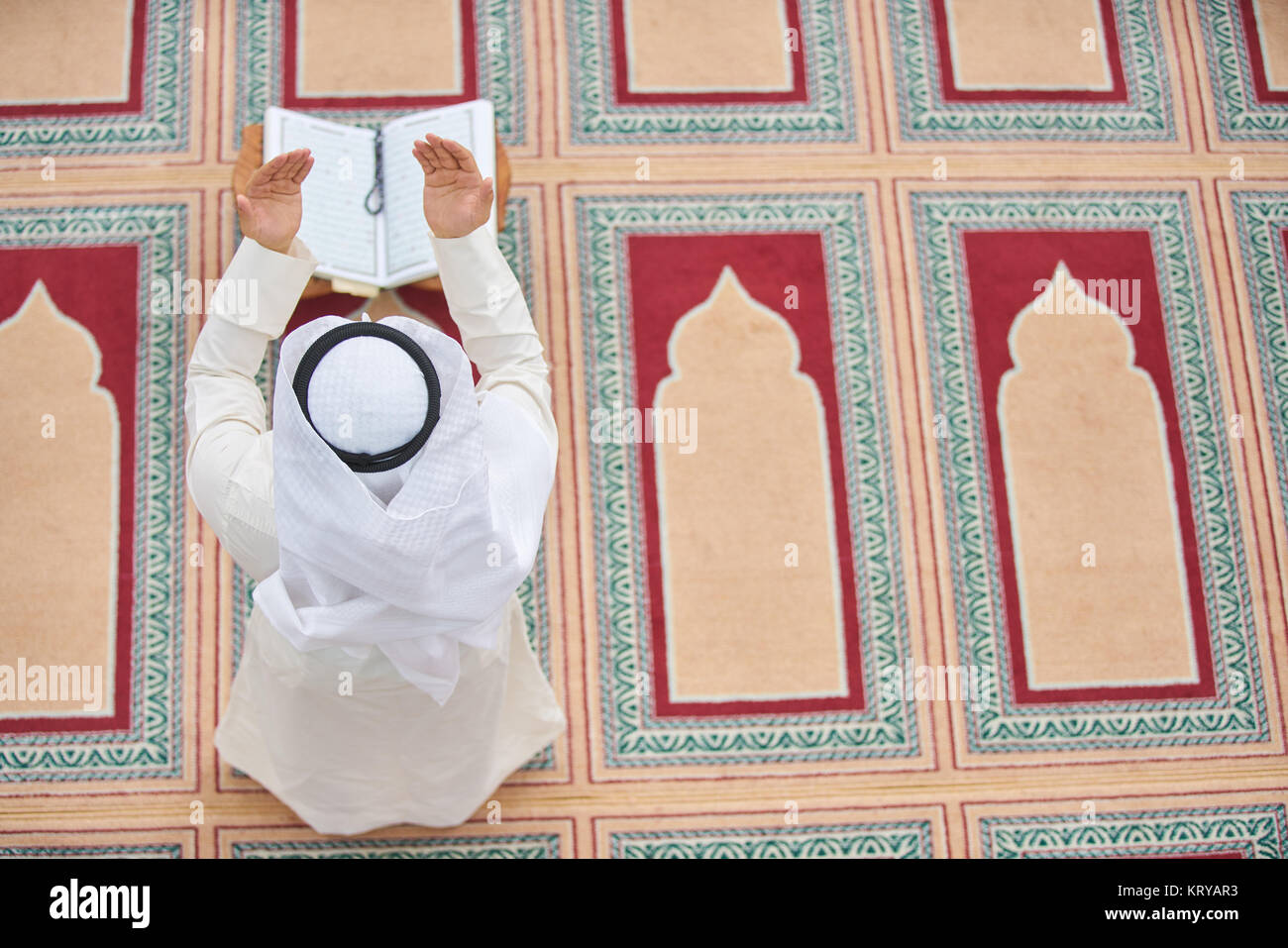 Religious muslim man praying inside the mosque Stock Photo - Alamy