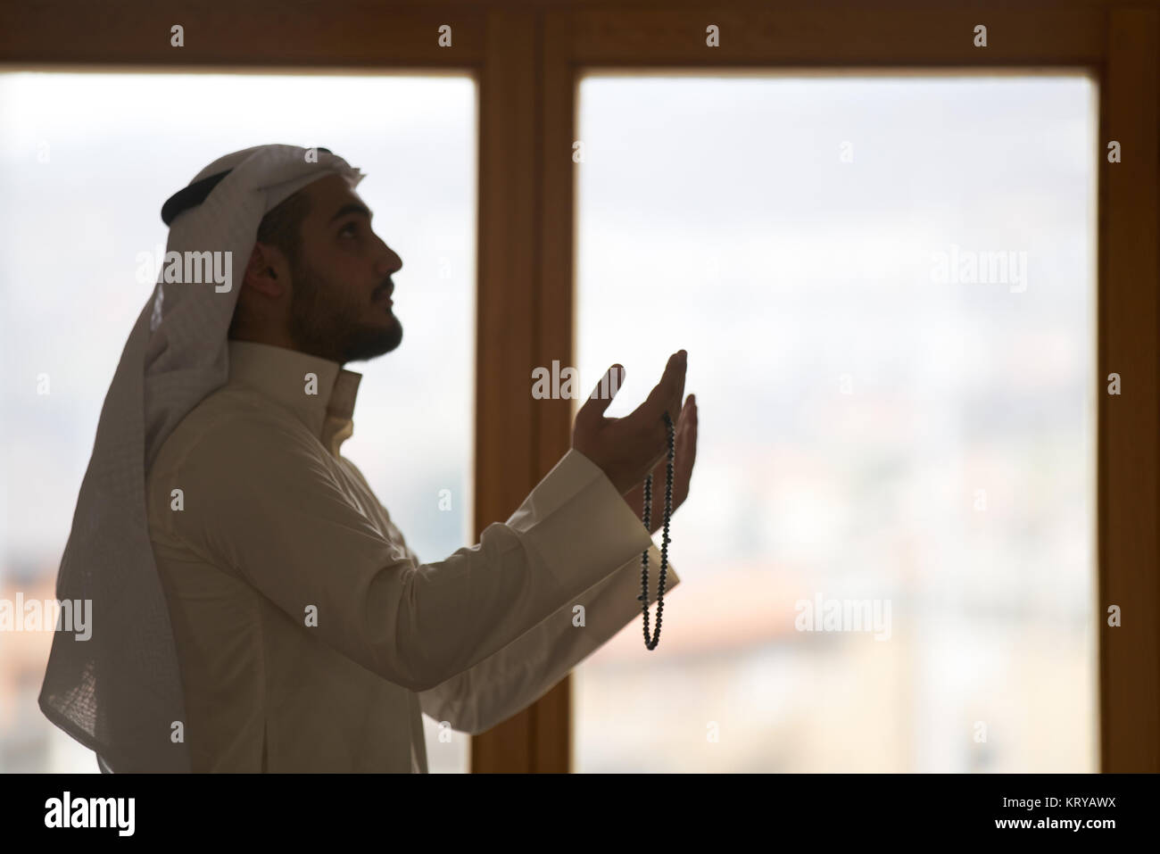 Religious muslim man praying inside the mosque Stock Photo - Alamy