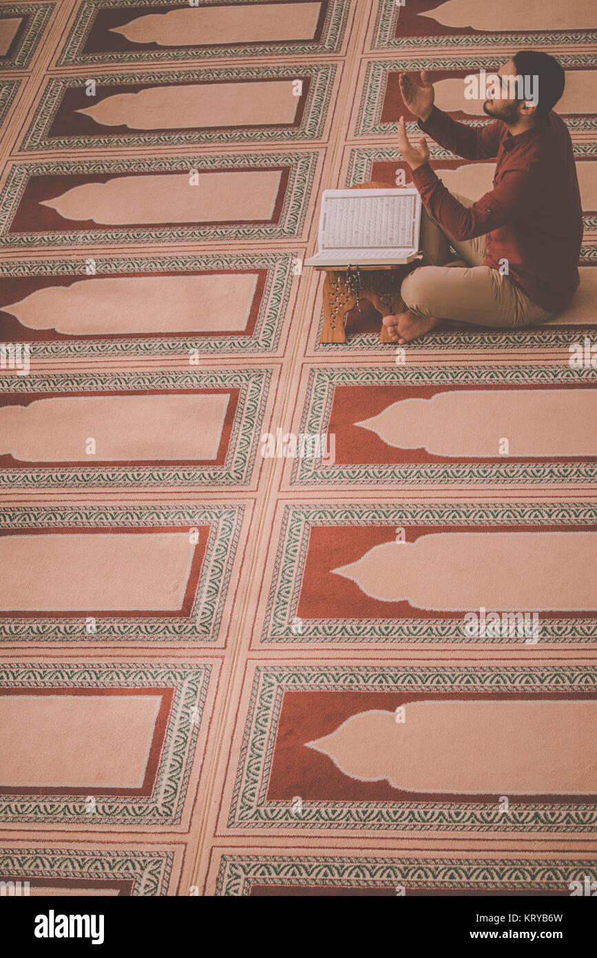 Religious muslim man praying inside the mosque Stock Photo - Alamy