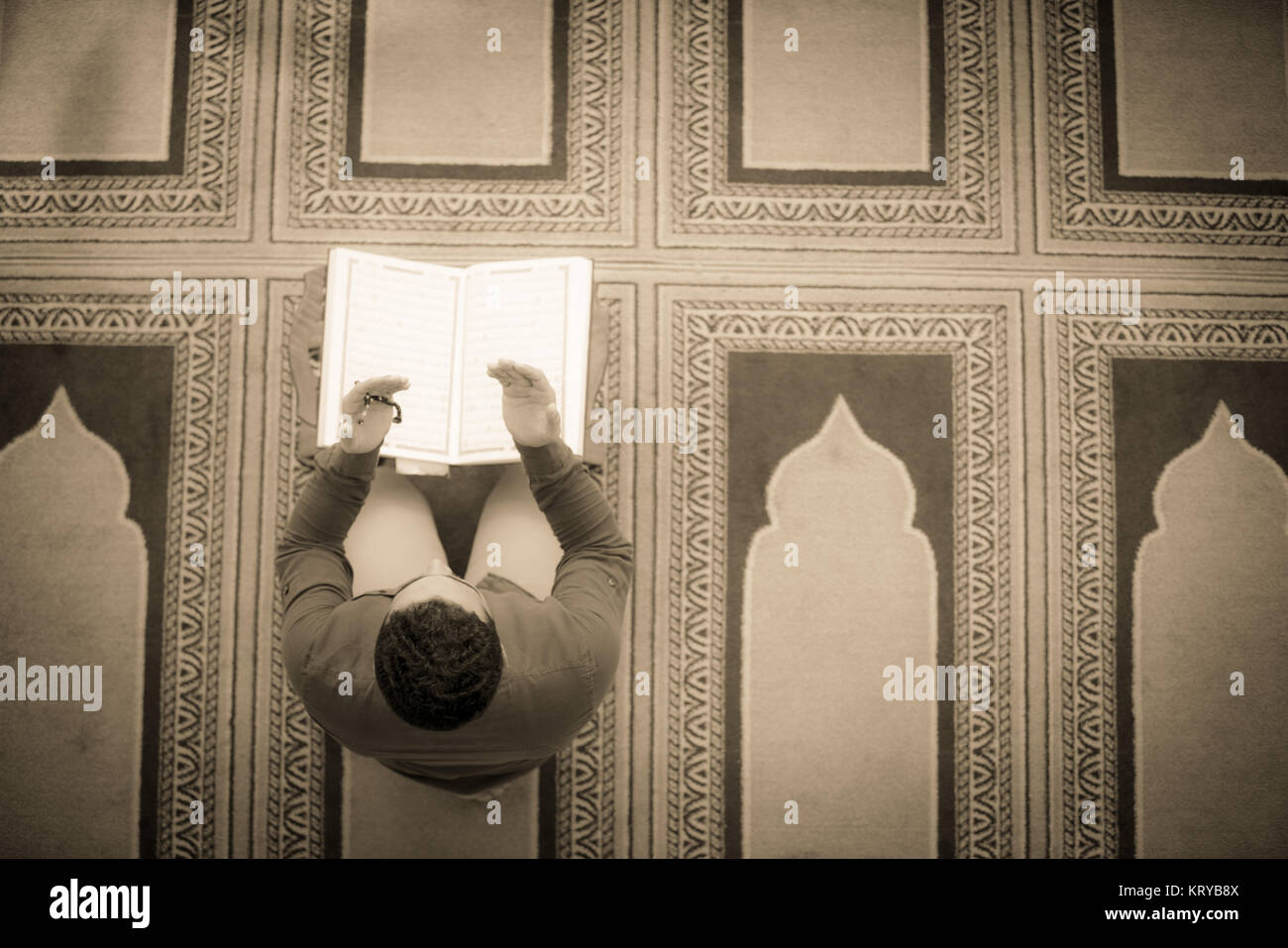 Religious muslim man praying inside the mosque Stock Photo - Alamy