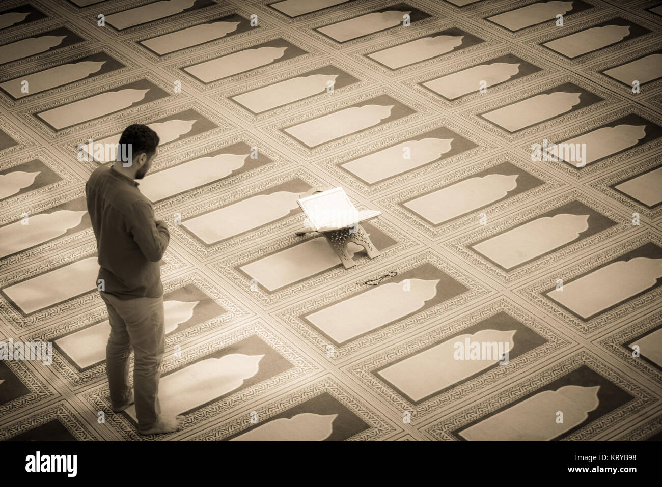 Religious muslim man praying inside the mosque Stock Photo - Alamy