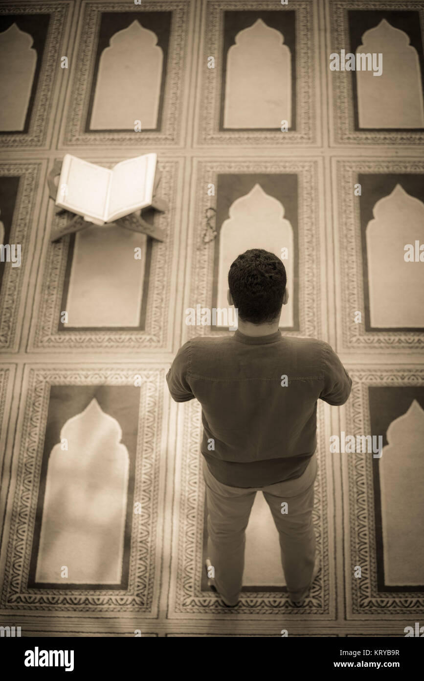 Religious muslim man praying inside the mosque Stock Photo - Alamy