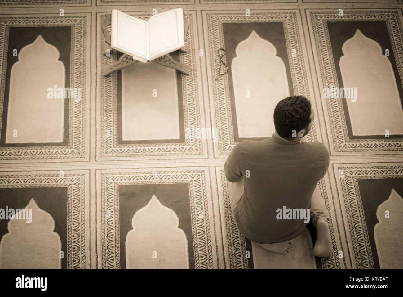Religious muslim man praying inside the mosque Stock Photo - Alamy